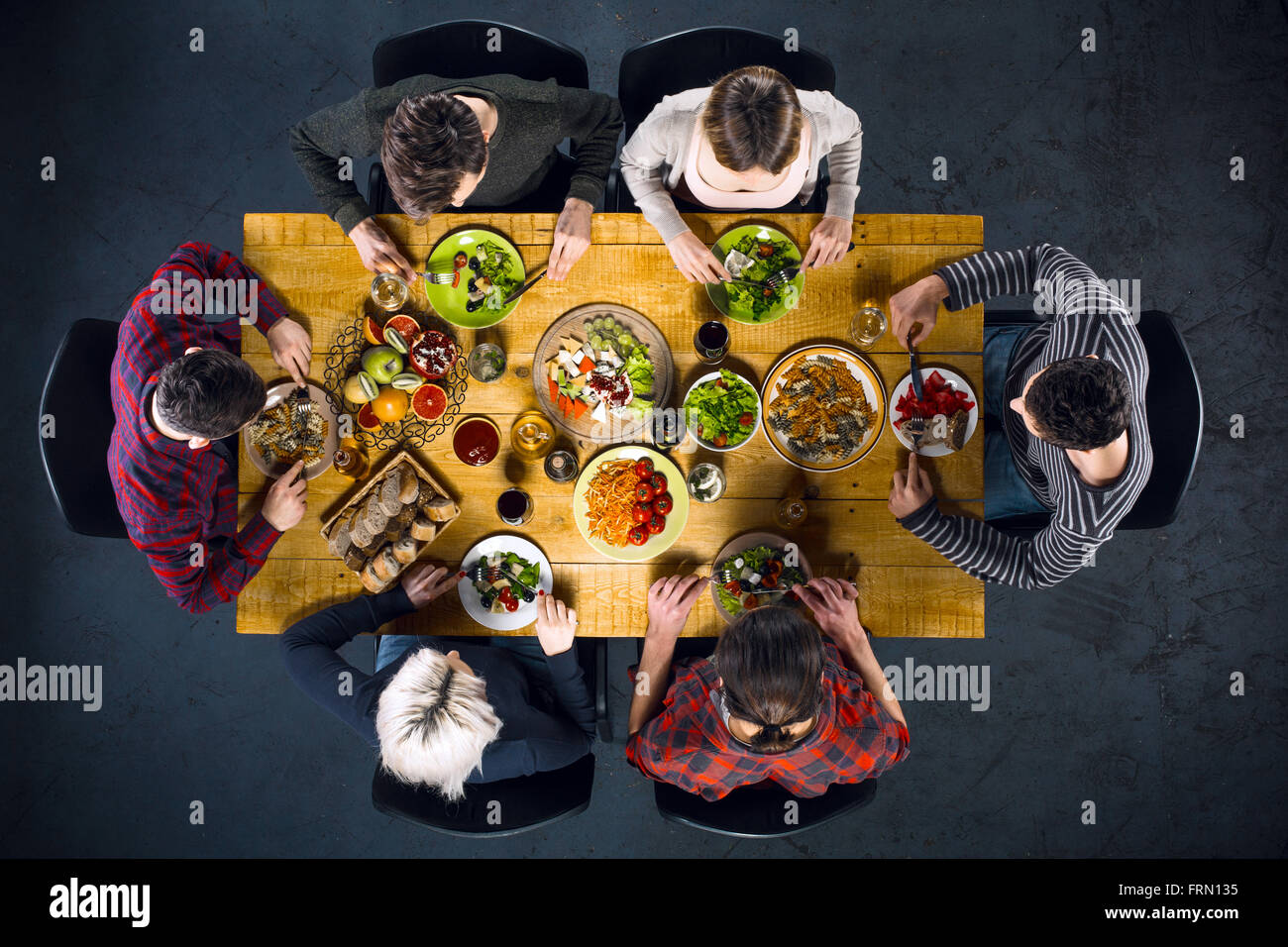 Top view of friends at table with food Stock Photo - Alamy