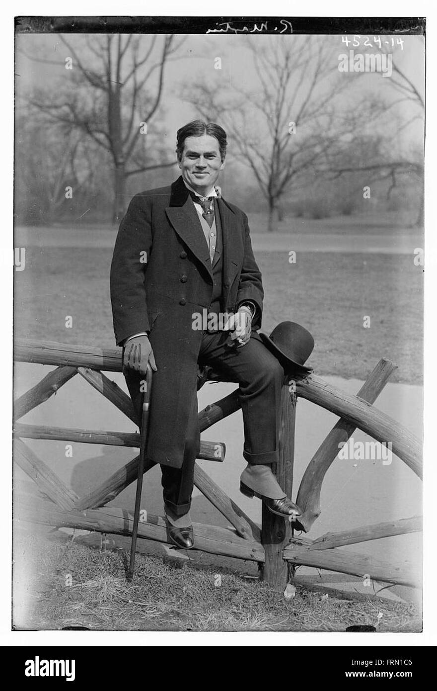 This historical photograph captures R Martin, providing insight into his life and the social ...