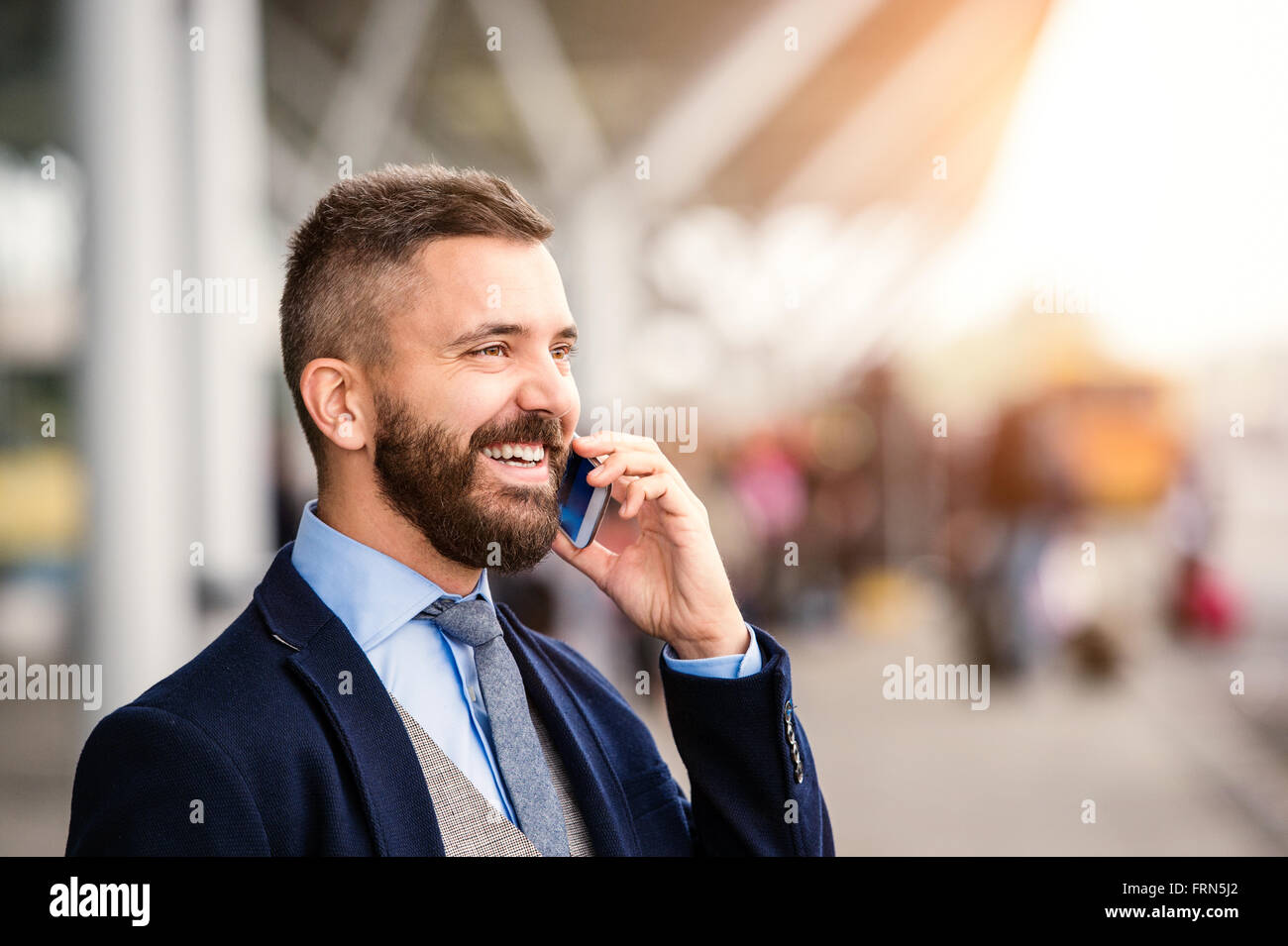 Hipster businessman making phone call waiting at the airport Stock ...