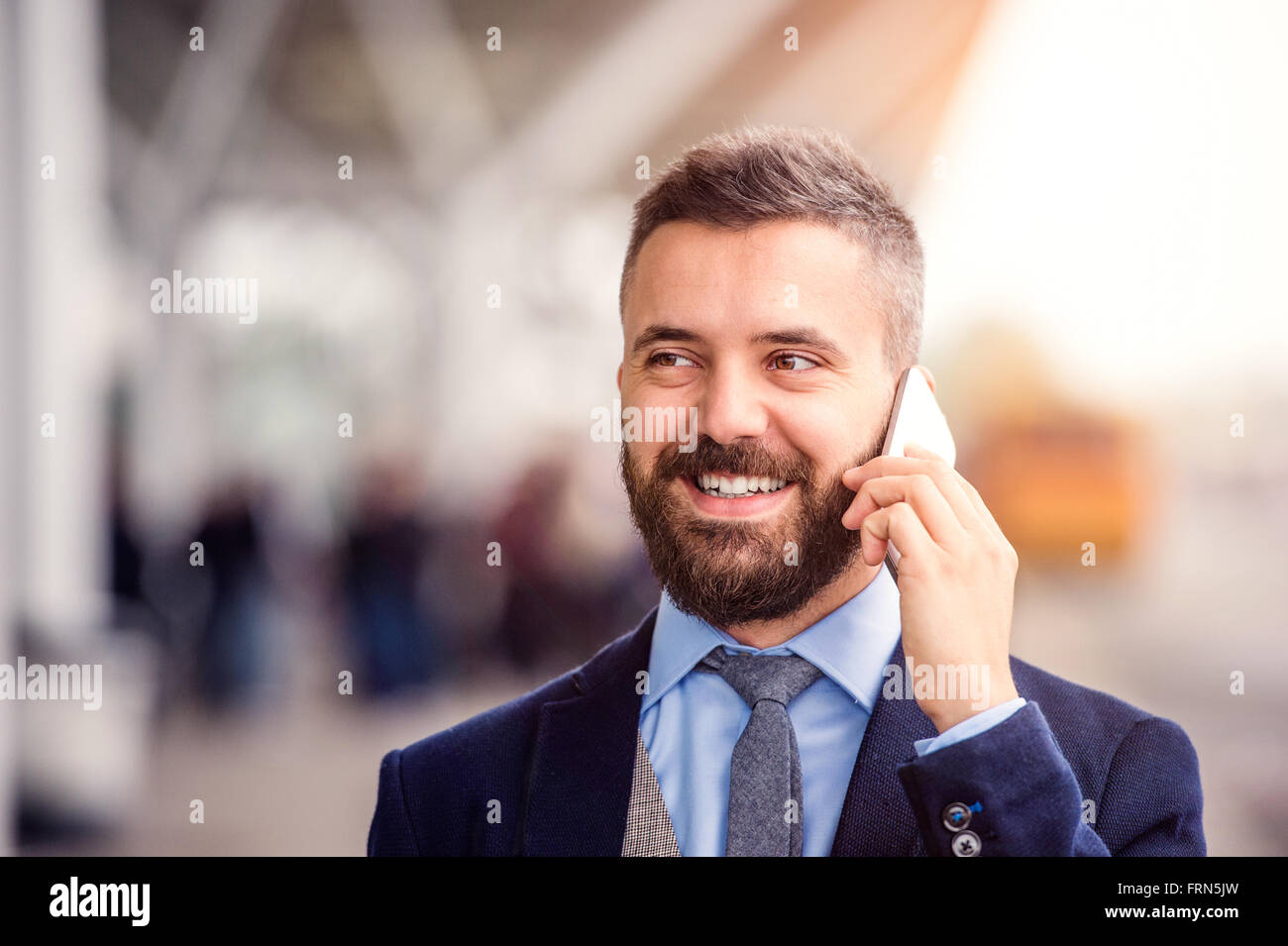 Hipster businessman making phone call waiting at the airport Stock ...