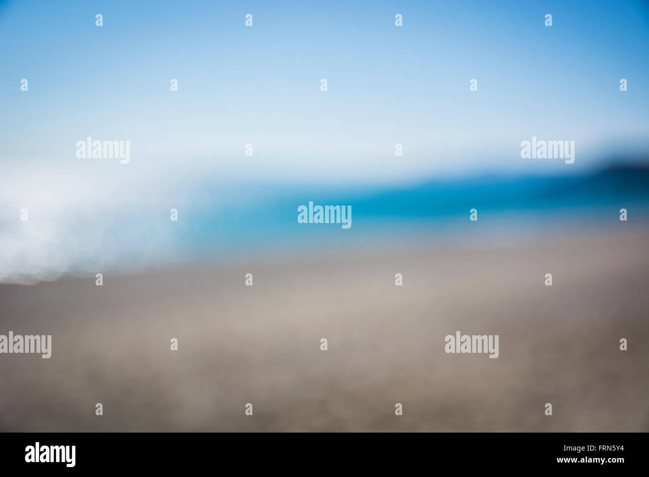 Blurred view on seashore in daylight Stock Photo - Alamy