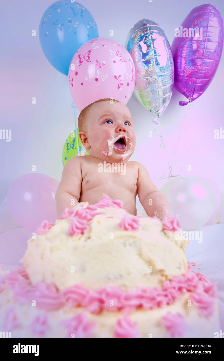 A baby smashing a birthday cake Stock Photo - Alamy