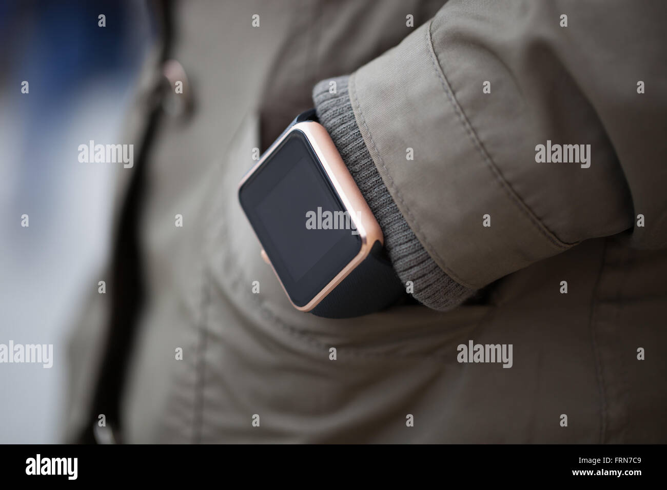 Model wearing smart watch on hand outdoors. This new digital technology ...