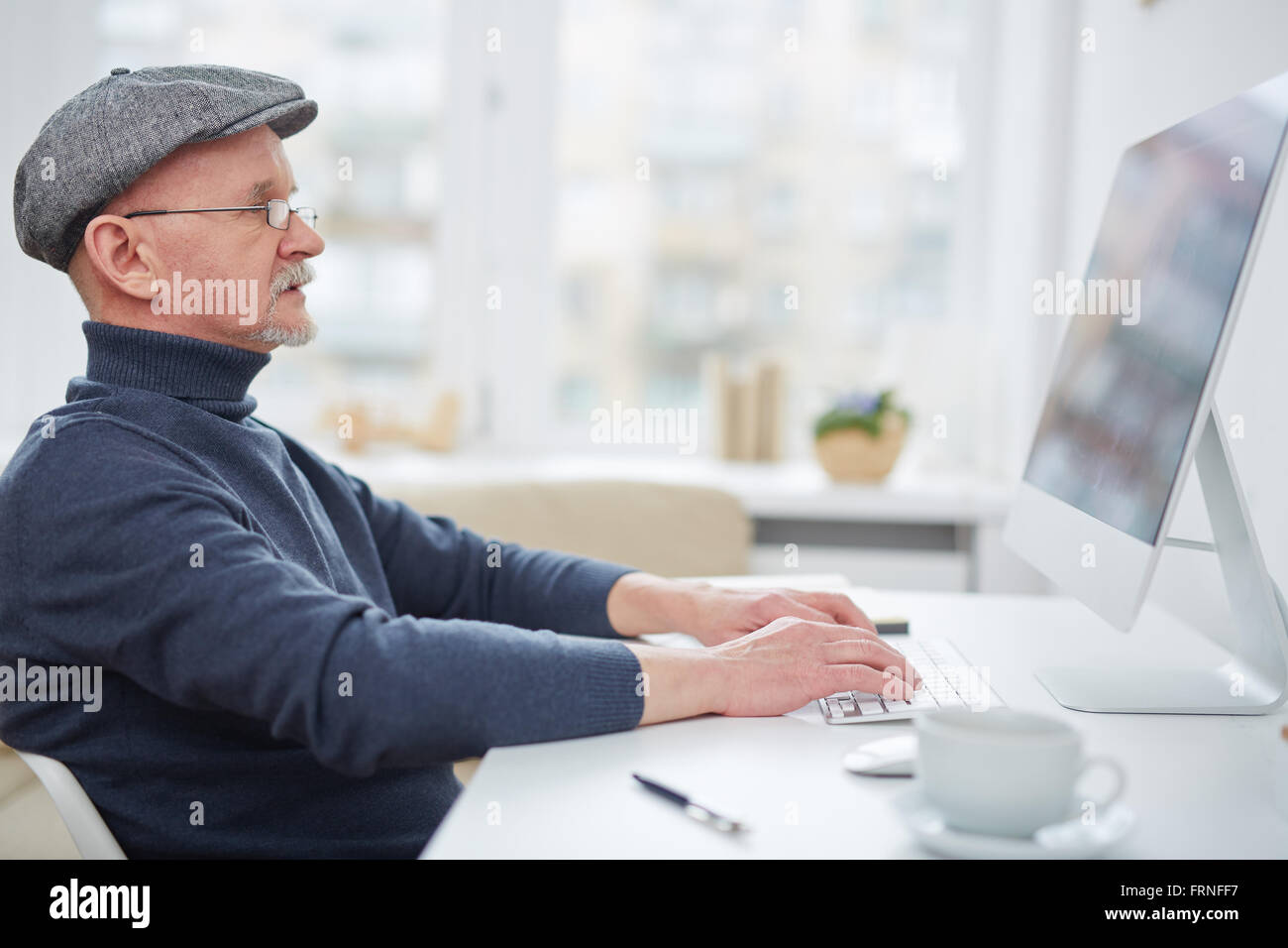 Portrait serious mature man typing hi-res stock photography and images ...