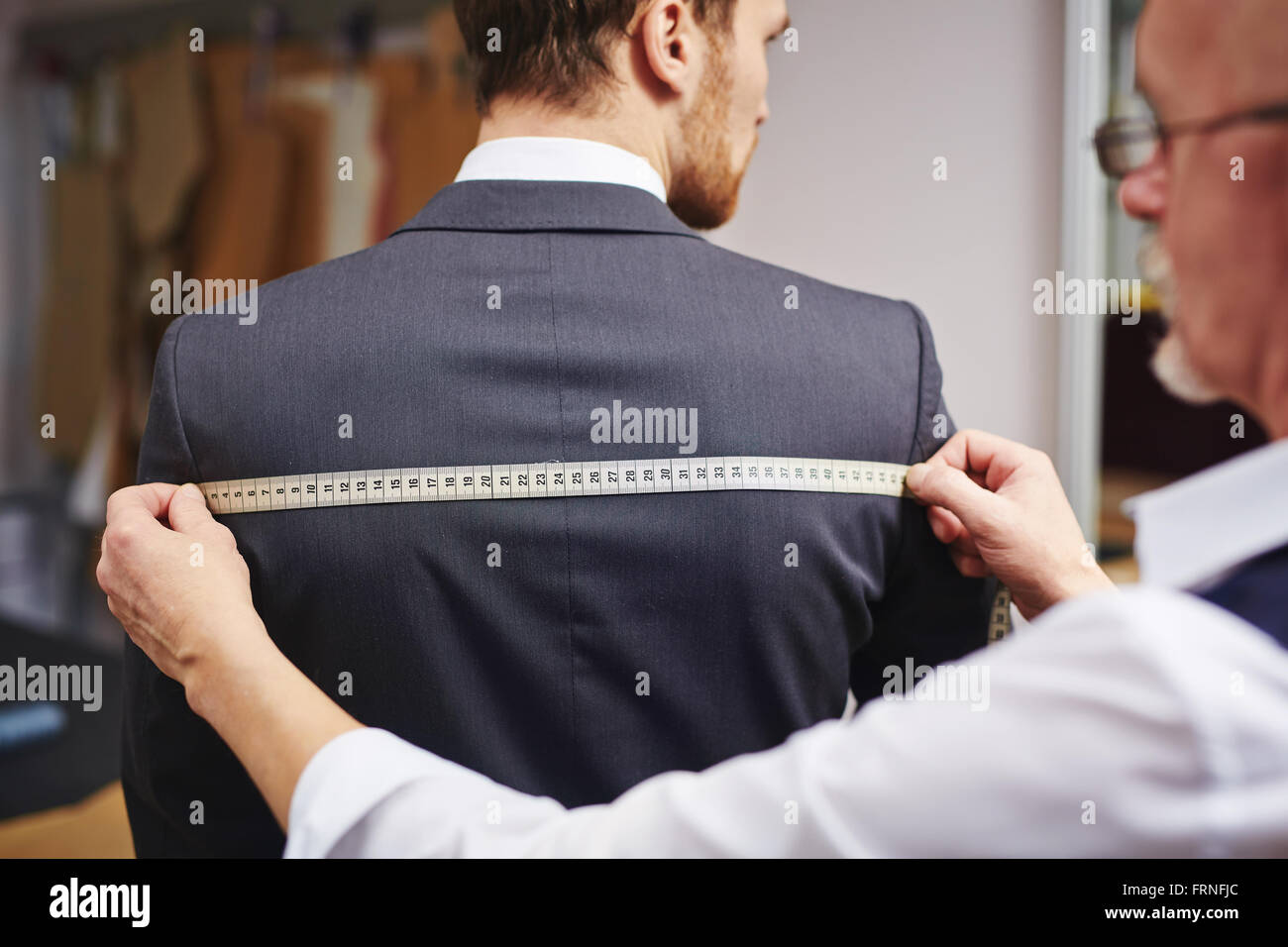 Measuring back of jacket Stock Photo - Alamy