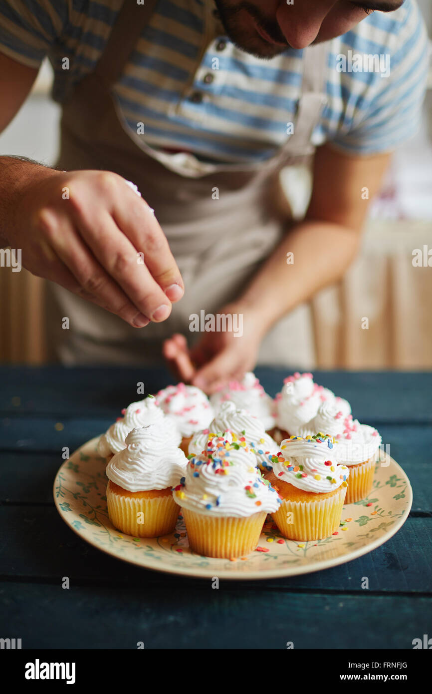Decorating with sprinkles Stock Photo - Alamy