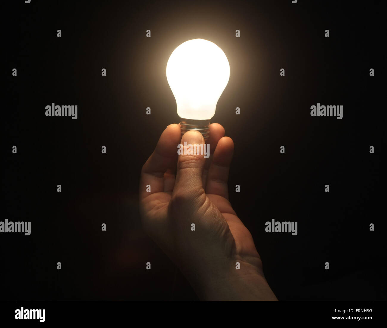 lighting lamp in hand Stock Photo - Alamy