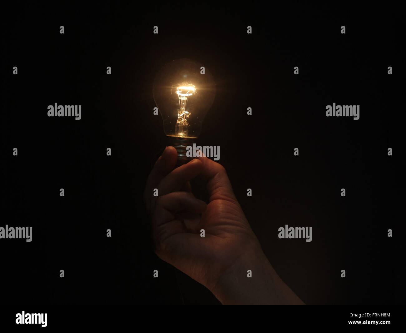 lighting lamp in hand Stock Photo - Alamy