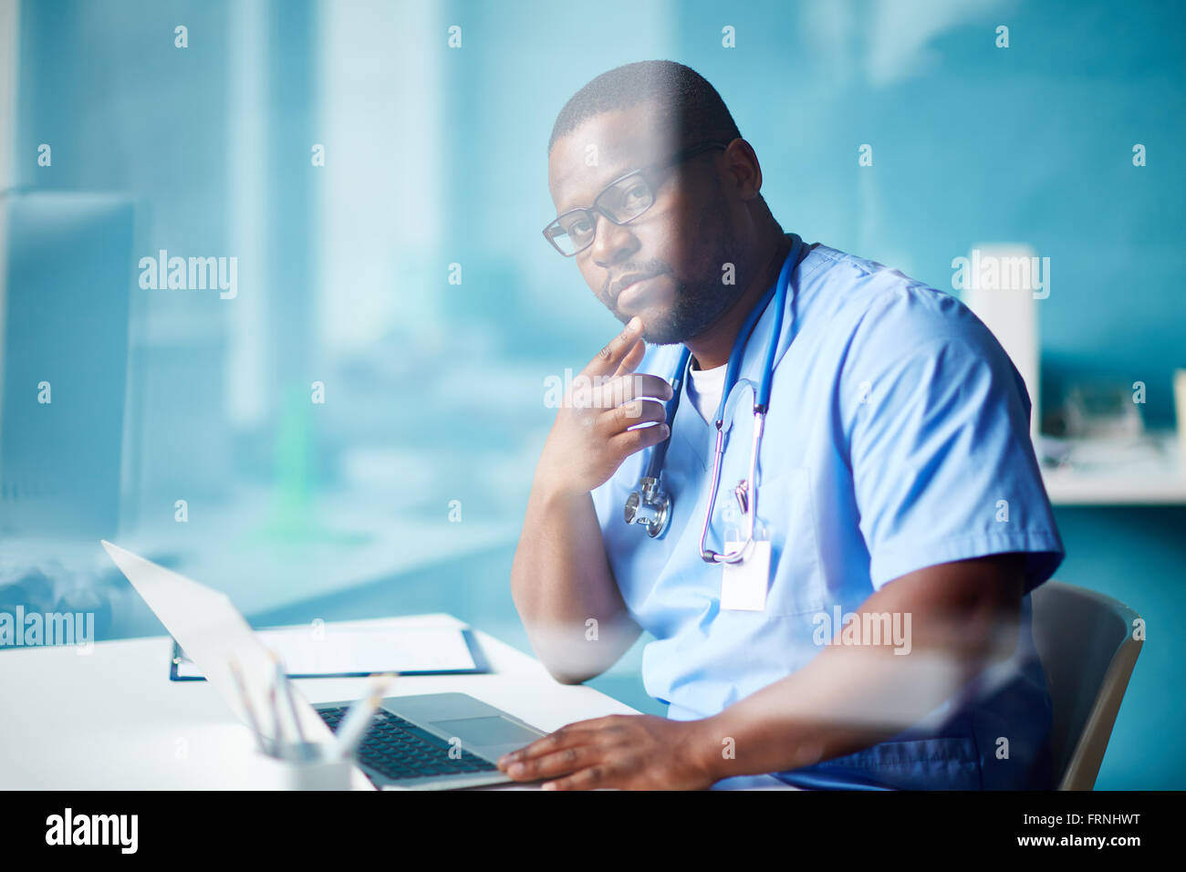 Doctor at office Stock Photo - Alamy