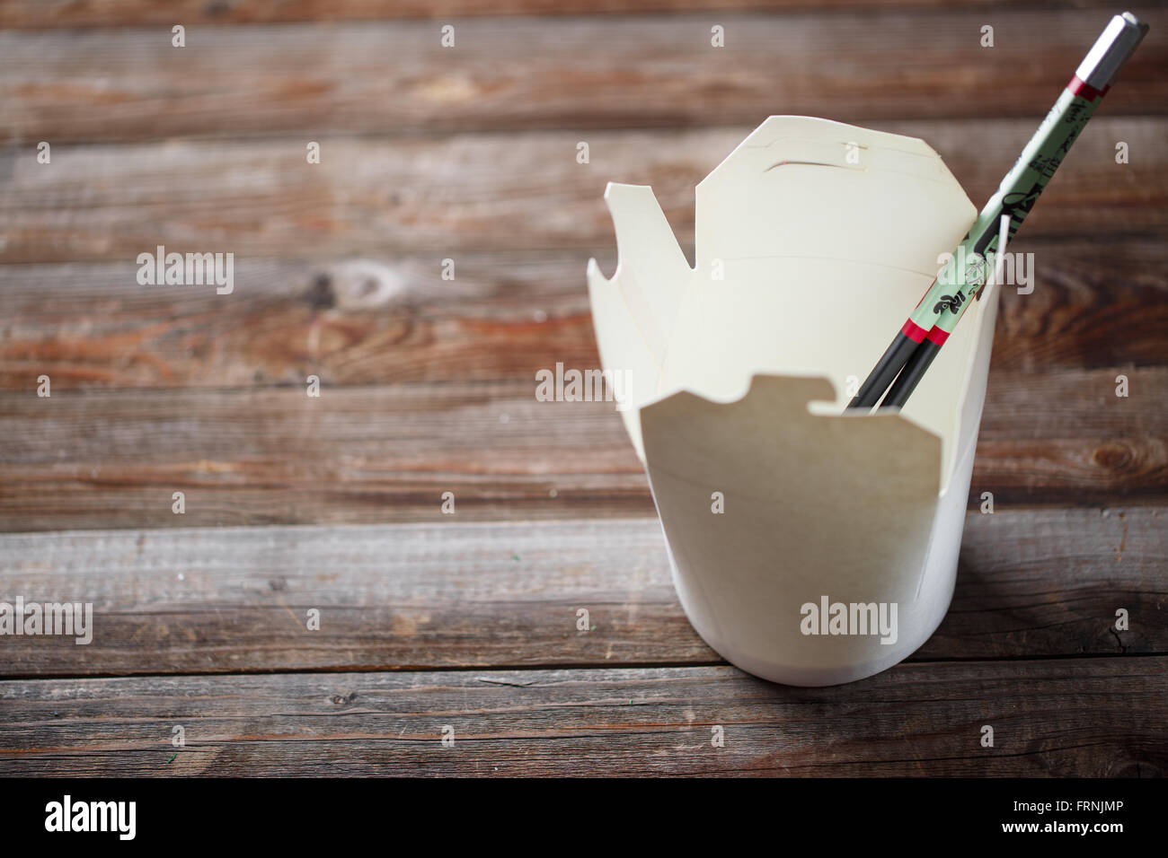 Blank Chinese food container on old wood table Stock Photo - Alamy
