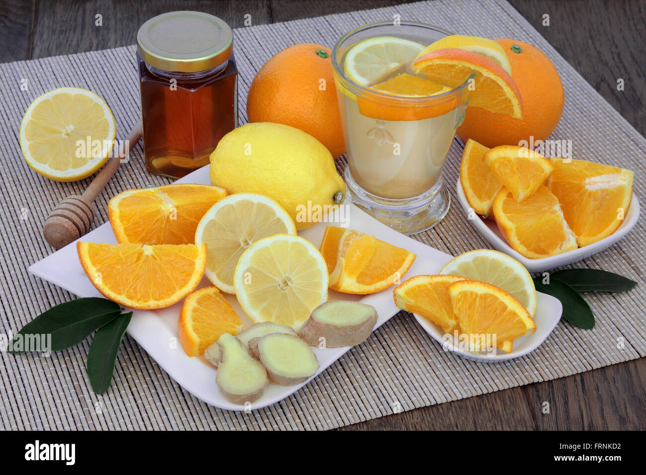 Natural flu and cold remedy drink in a glass with orange and lemon ...