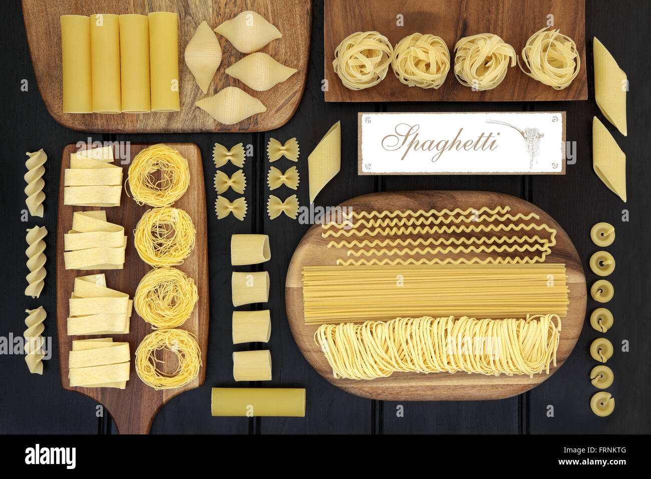 Large dried pasta food selection on maple boards with old spaghetti ...