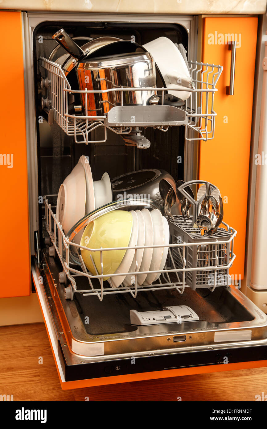 Clean dishes in dishwashing machine in closeup Stock Photo - Alamy