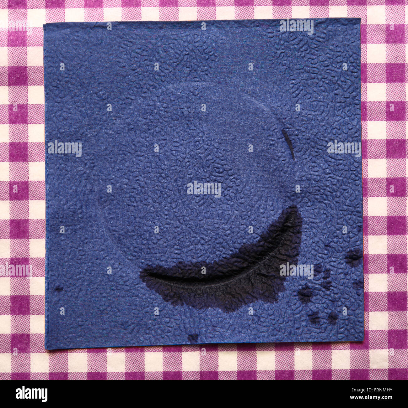 Single used paper blue napkin in closeup Stock Photo - Alamy