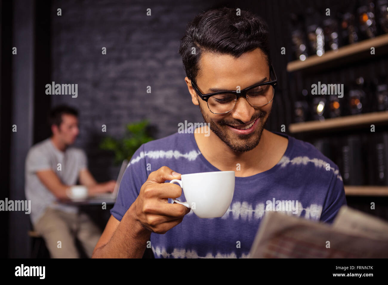 Man reading the newspaper and drinking coffee Stock Photo - Alamy