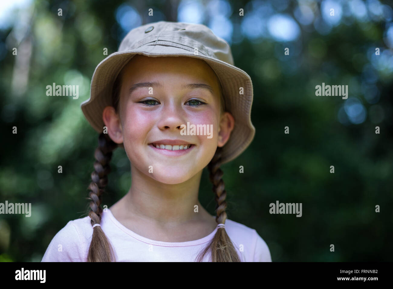 Portrait of happy girl in back yard Stock Photo - Alamy