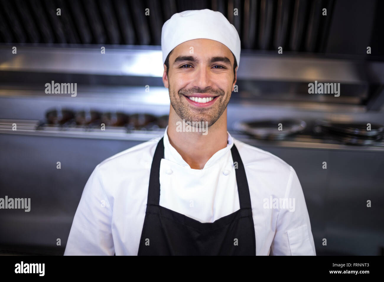 Handsome chef looking at camera Stock Photo - Alamy