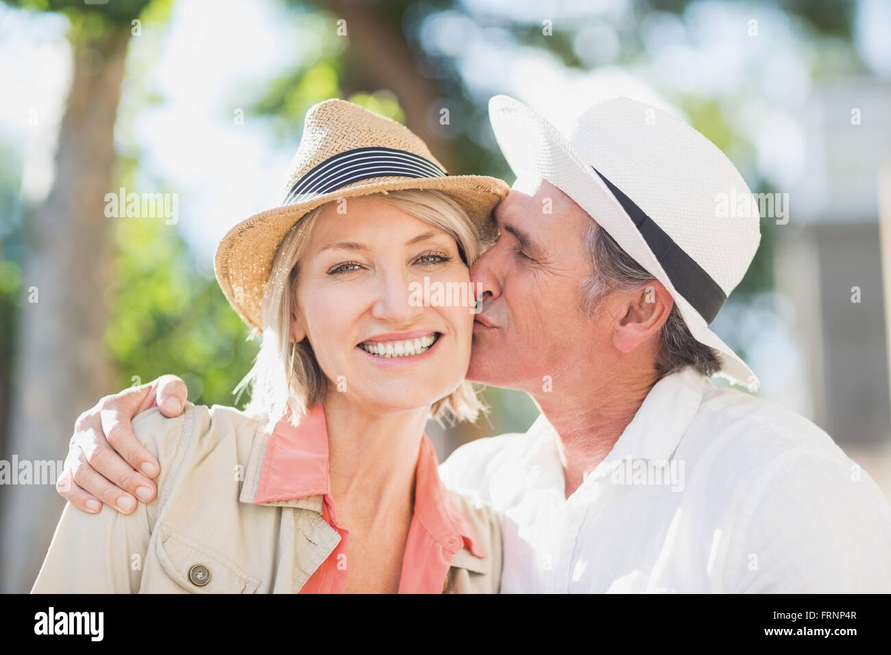 Man kissing woman Stock Photo - Alamy