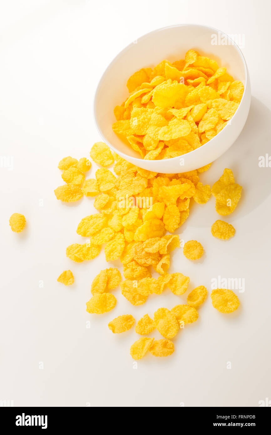 Yellow corn flakes in the white bowl Stock Photo - Alamy