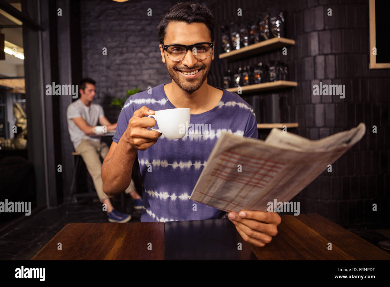 Man reading the newspaper and drinking coffee Stock Photo - Alamy