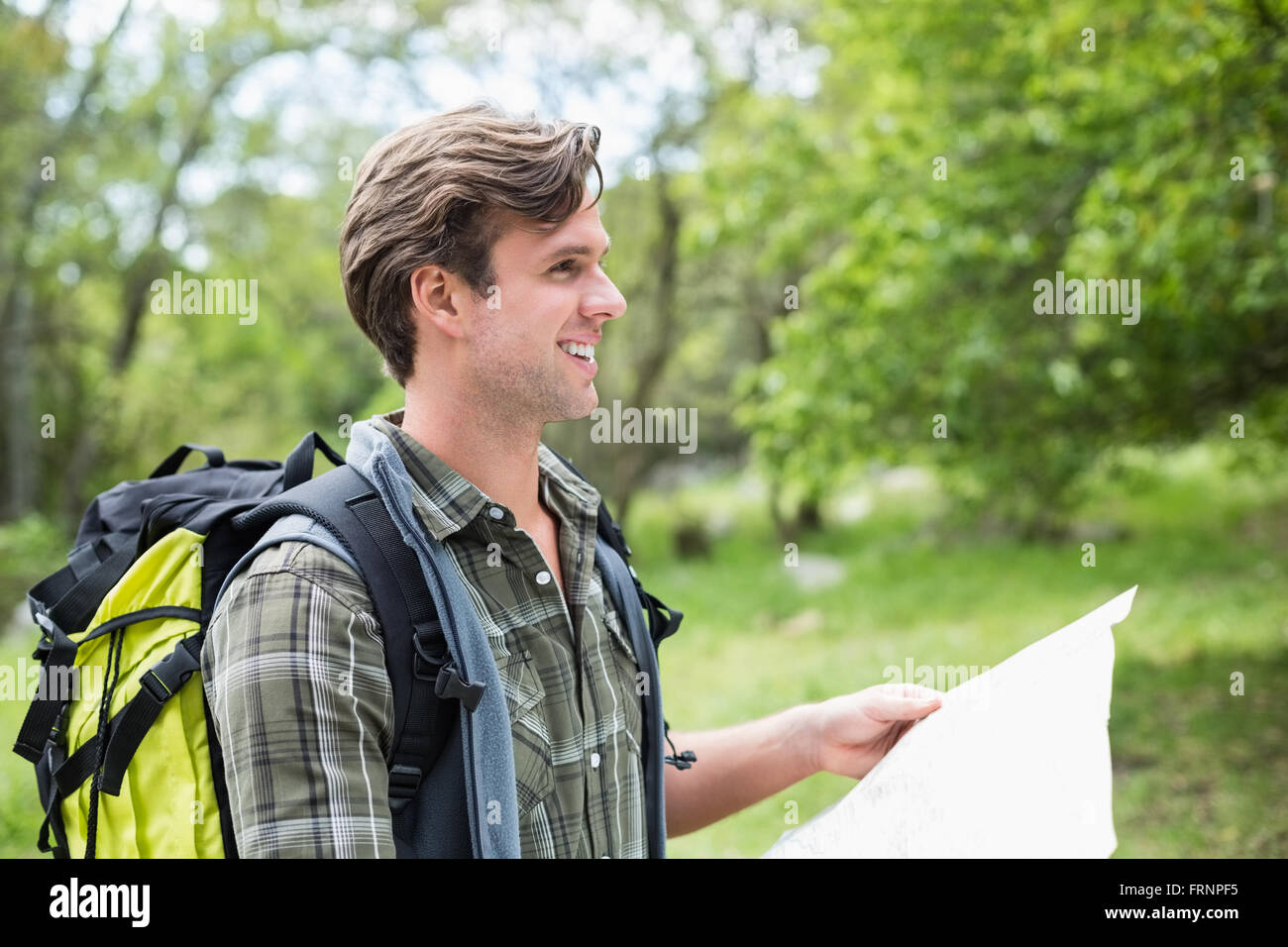 Close-up of happy man with map Stock Photo - Alamy