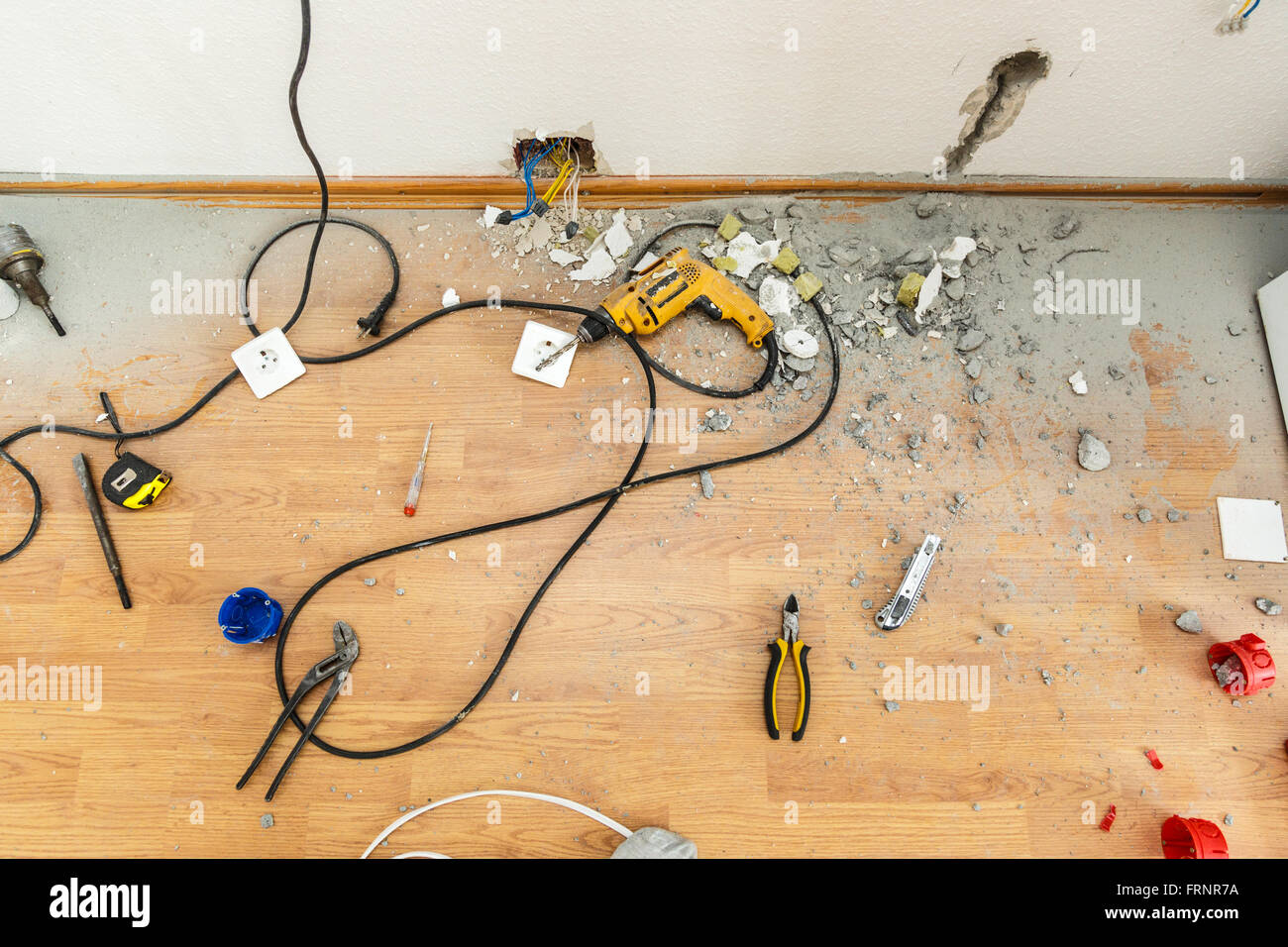 Place of electric socket repair process with drill Stock Photo - Alamy