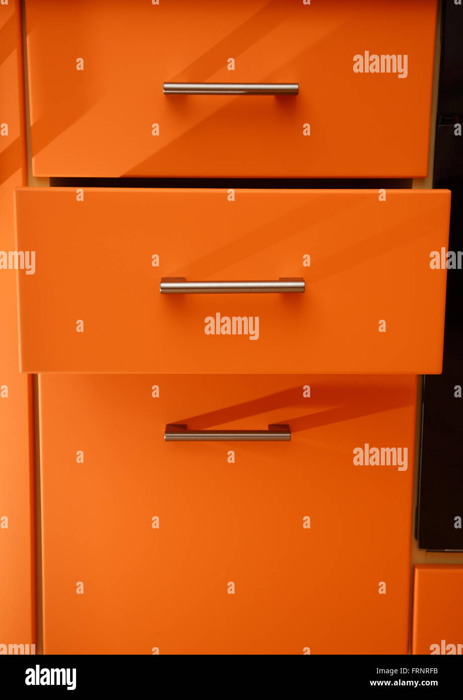 Orange wooden kitchen drawers as background closeup Stock Photo - Alamy