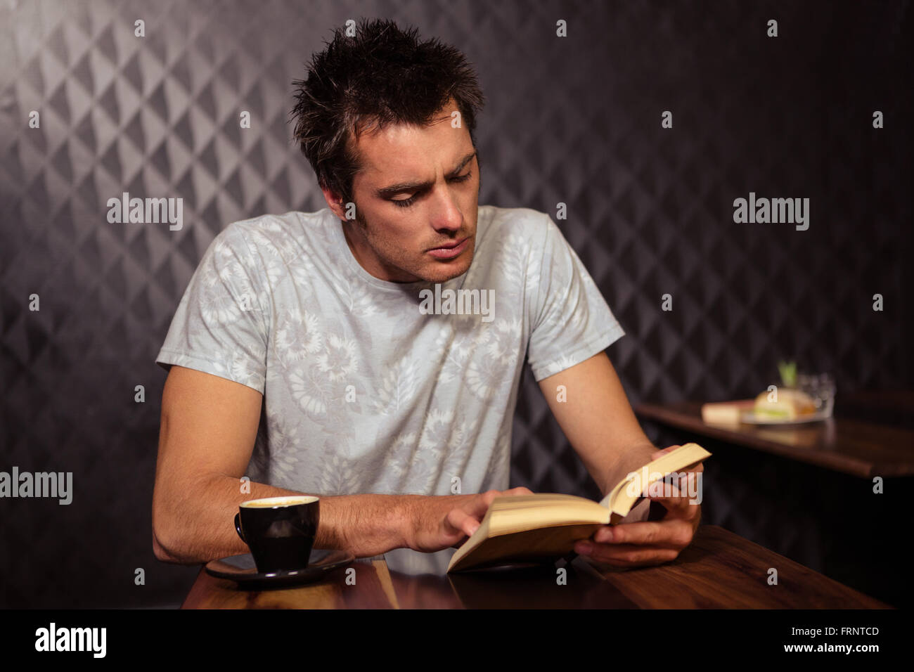 Coffee table with man reading hi-res stock photography and images - Alamy