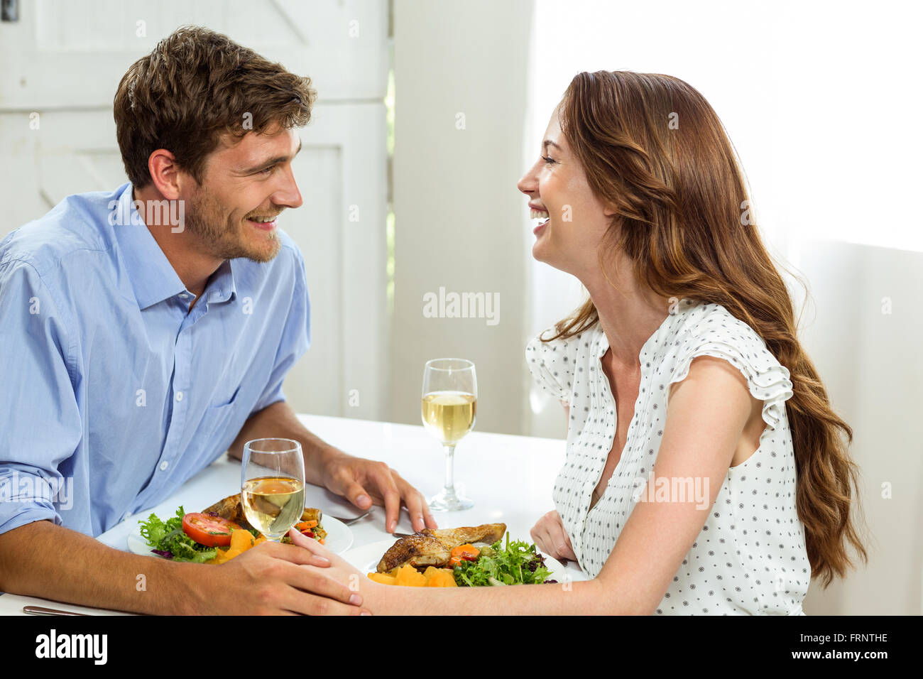 Happy romantic couple having lunch Stock Photo - Alamy