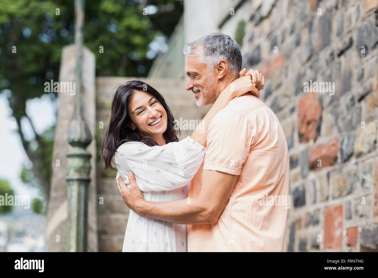 Happy couple embracing each other Stock Photo - Alamy
