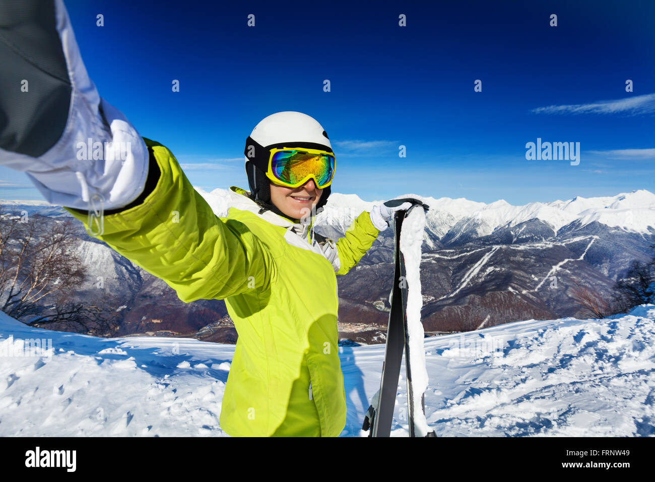 Woman smiling ski poles hi-res stock photography and images - Alamy