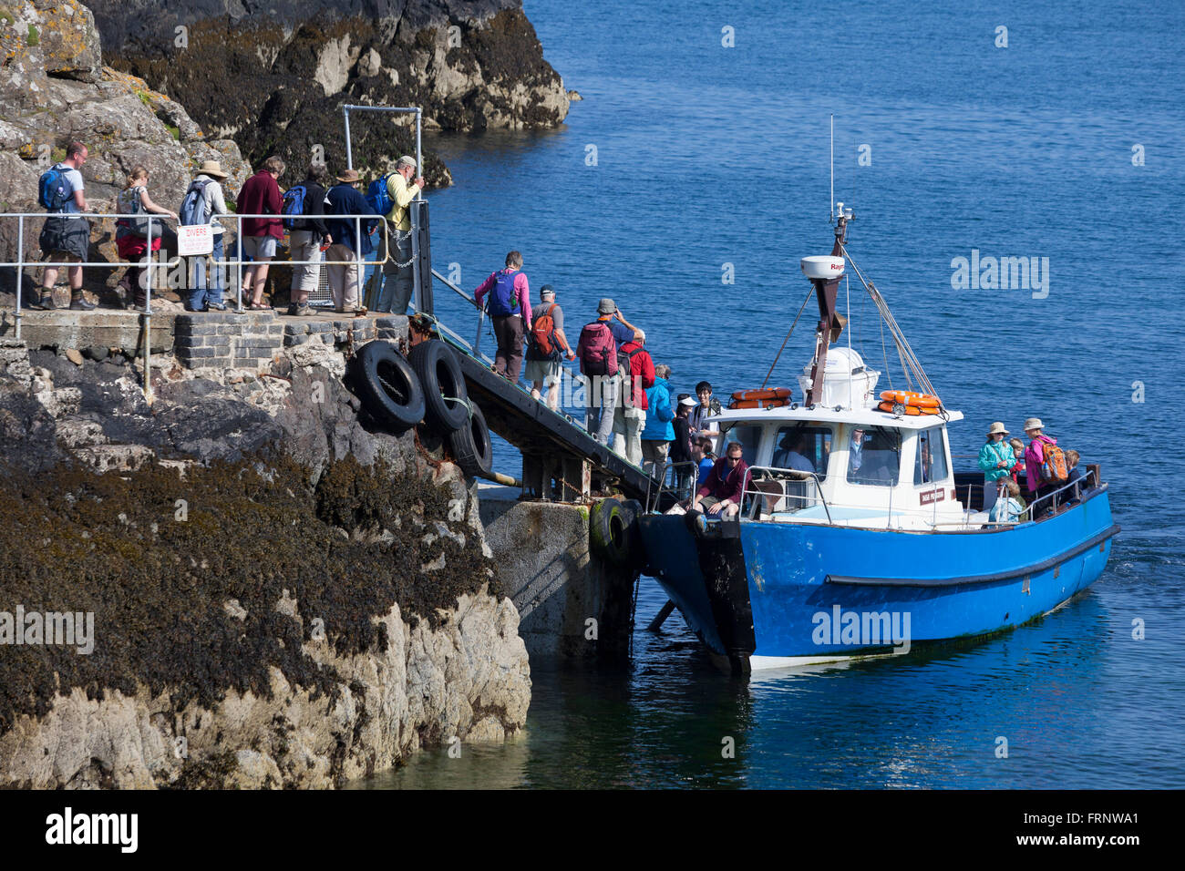 The small boat that ferries tourists to Skomer island off of the ...