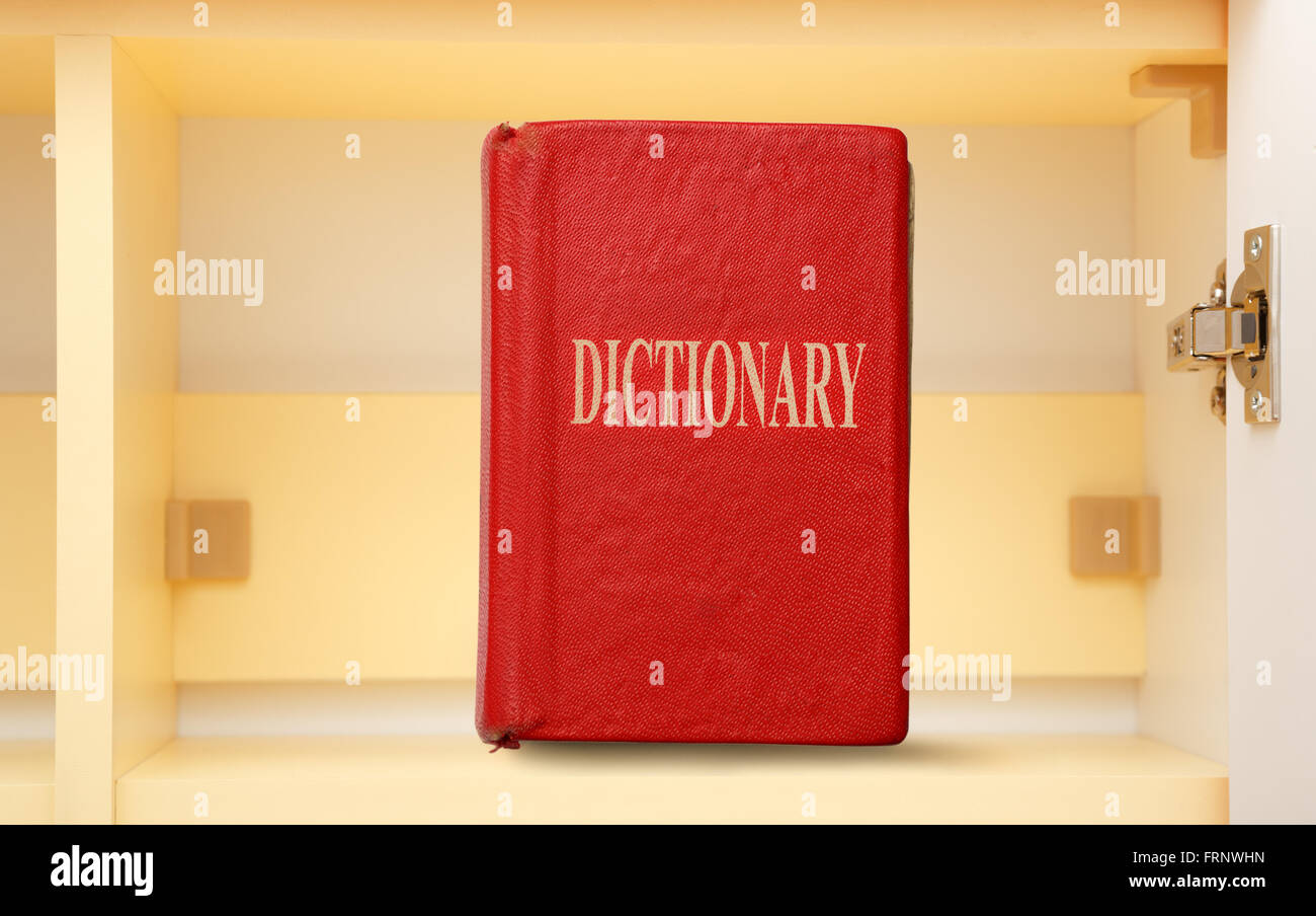 Old red dictionary on wooden background closeup Stock Photo - Alamy