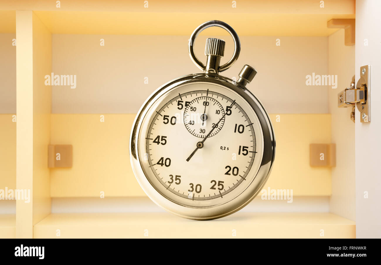 Photo of single stopwatch on wooden shelf Stock Photo - Alamy