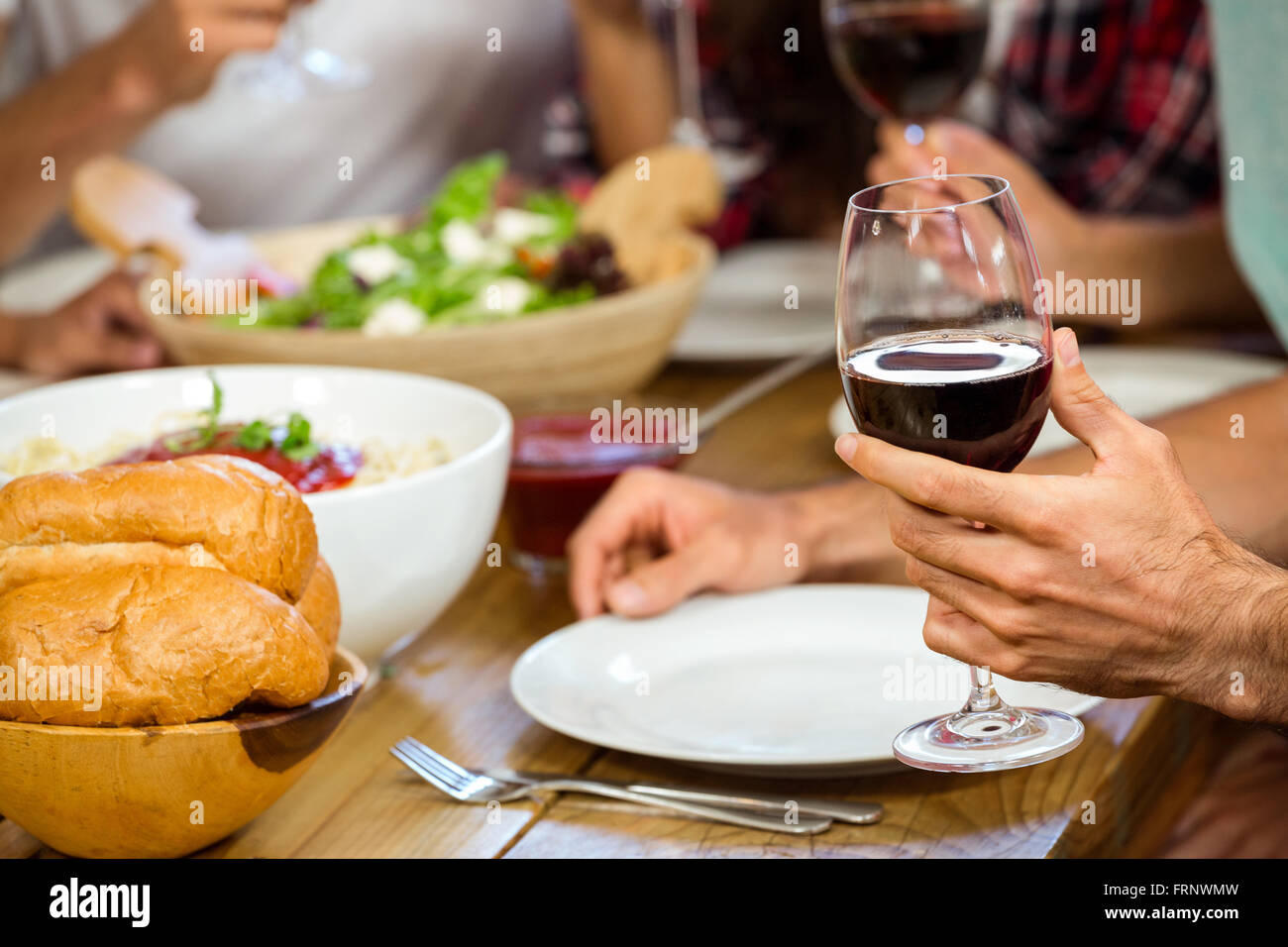 Friends having meal together Stock Photo - Alamy