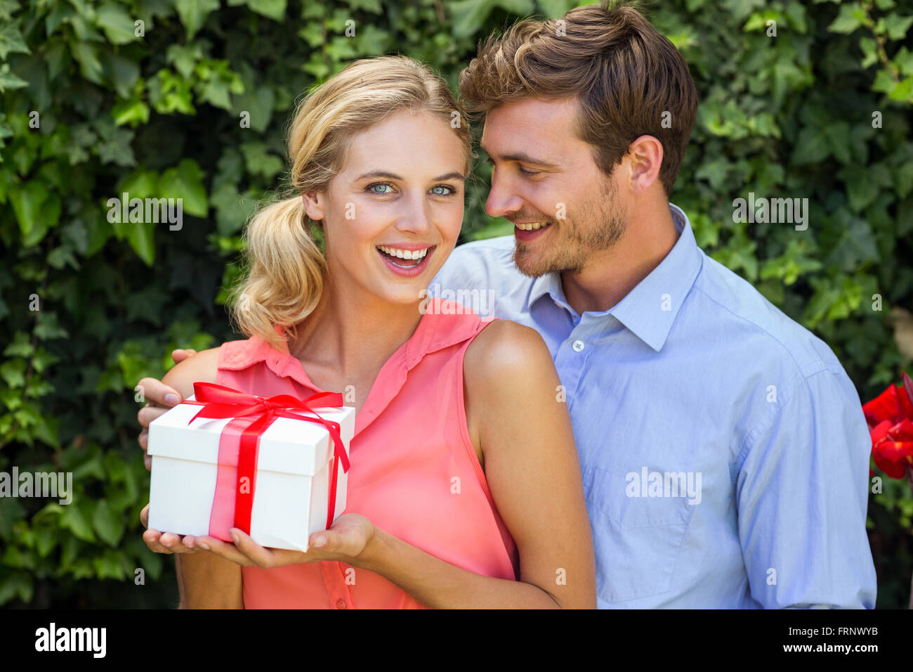 Handsome man giving gift hi-res stock photography and images - Alamy