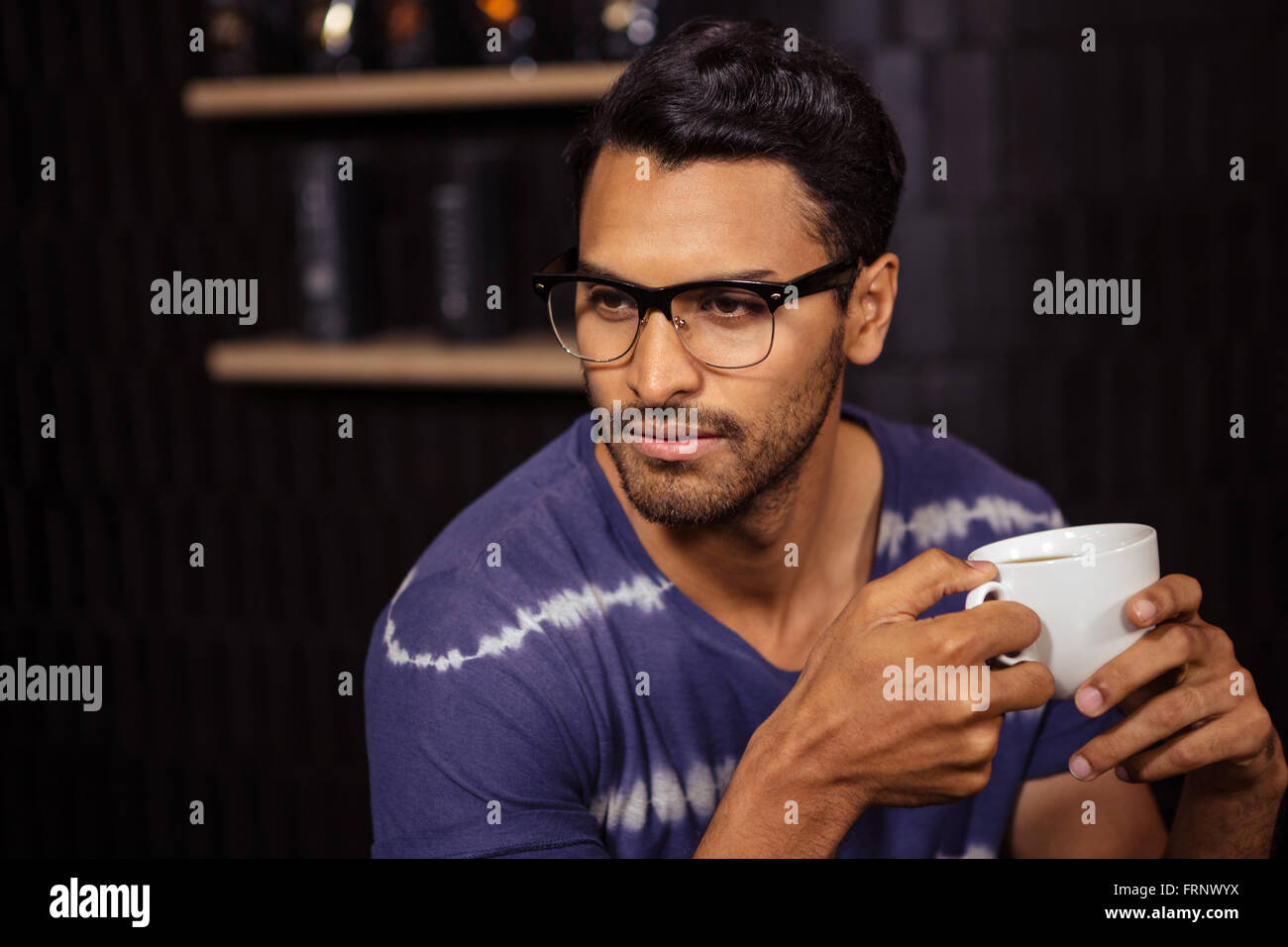 Man holding a cup of coffee Stock Photo - Alamy