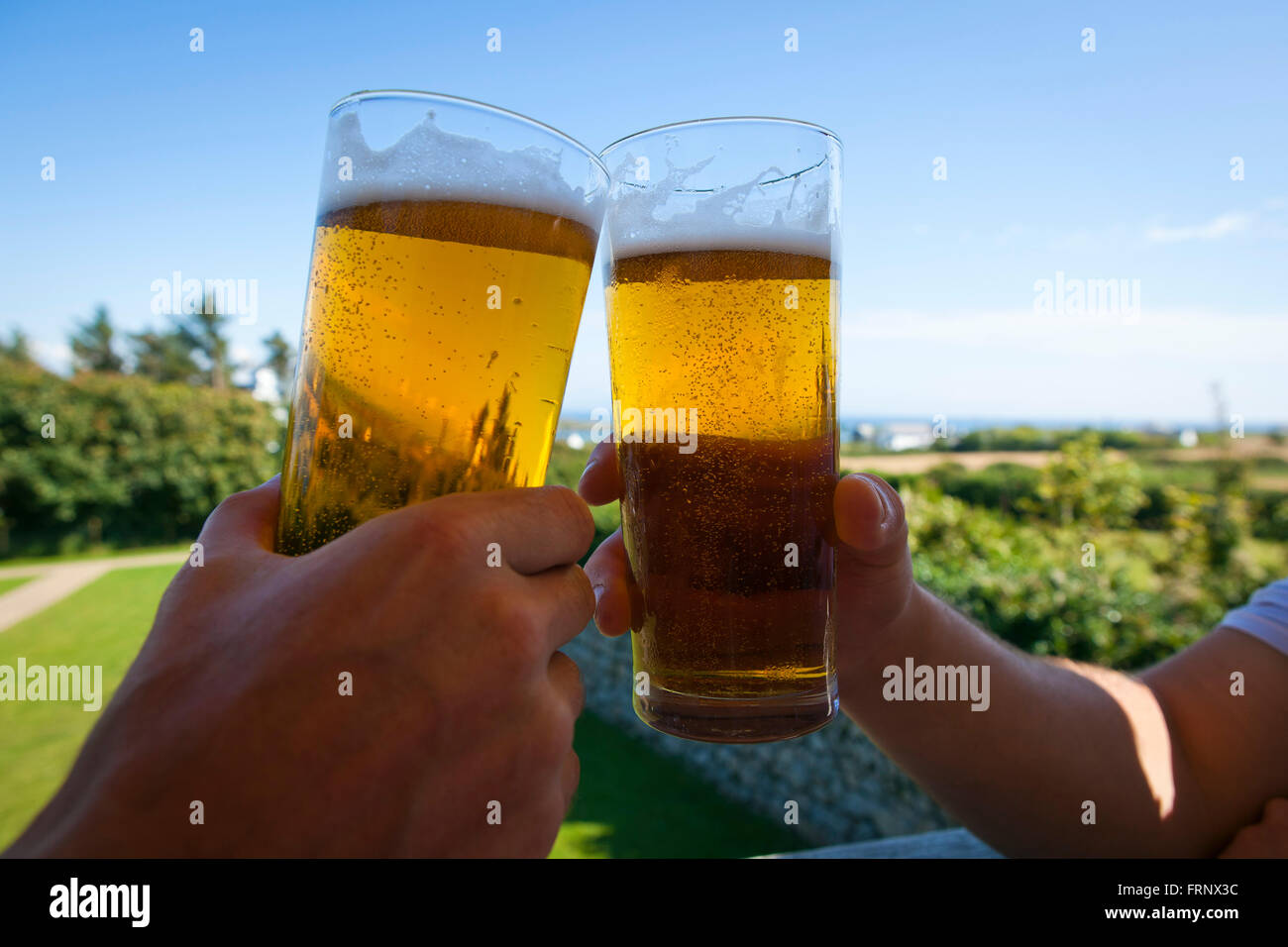 Pints cheers in pub hi-res stock photography and images - Alamy