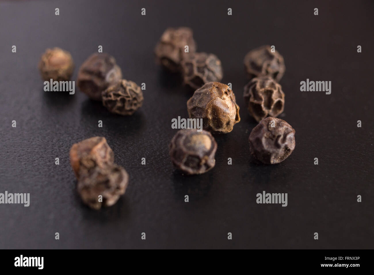 pepper grain on black background Stock Photo - Alamy