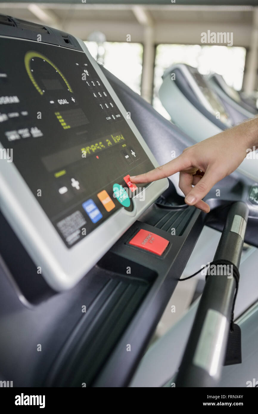 Woman touching the console display of treadmill Stock Photo - Alamy