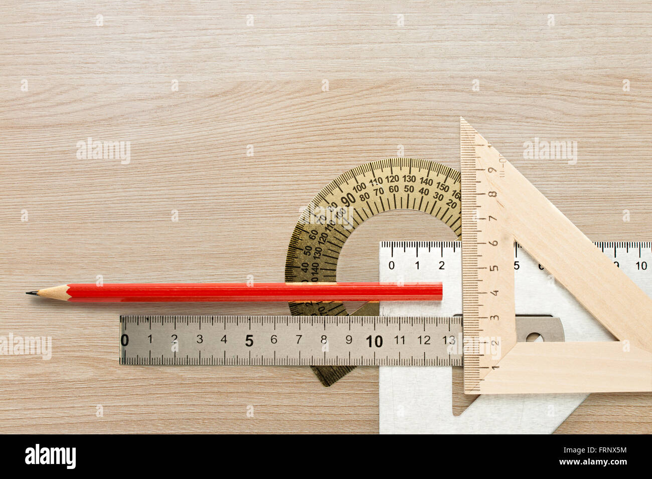 Drafting wooden and steel tools with pencil in closeup Stock Photo - Alamy