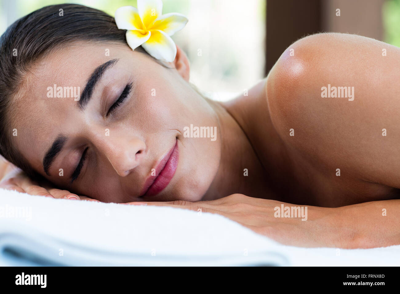Woman relaxing on massage table Stock Photo - Alamy