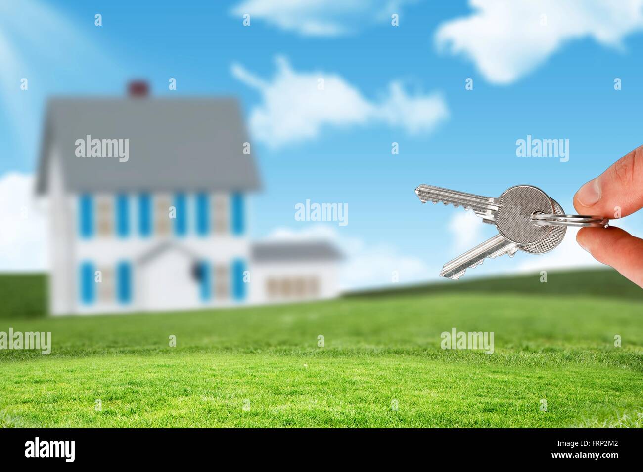 Hand holding front door keys Stock Photo - Alamy