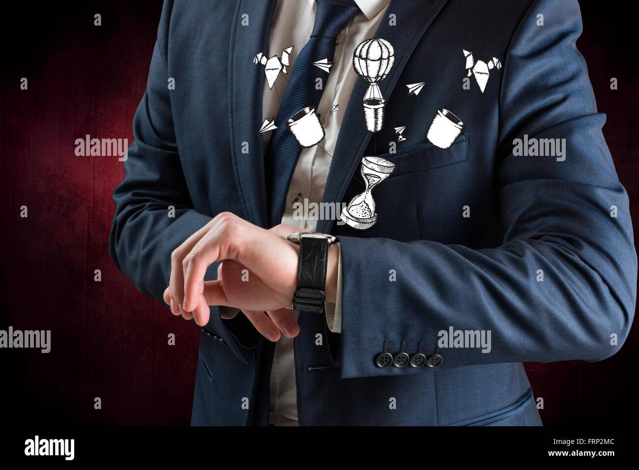 Businessman looking at his watch Stock Photo - Alamy