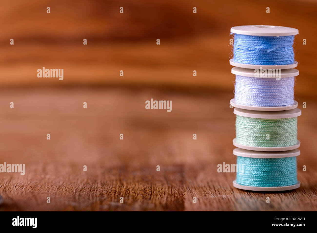 cotton sewing in all shades of blue on wood Stock Photo - Alamy