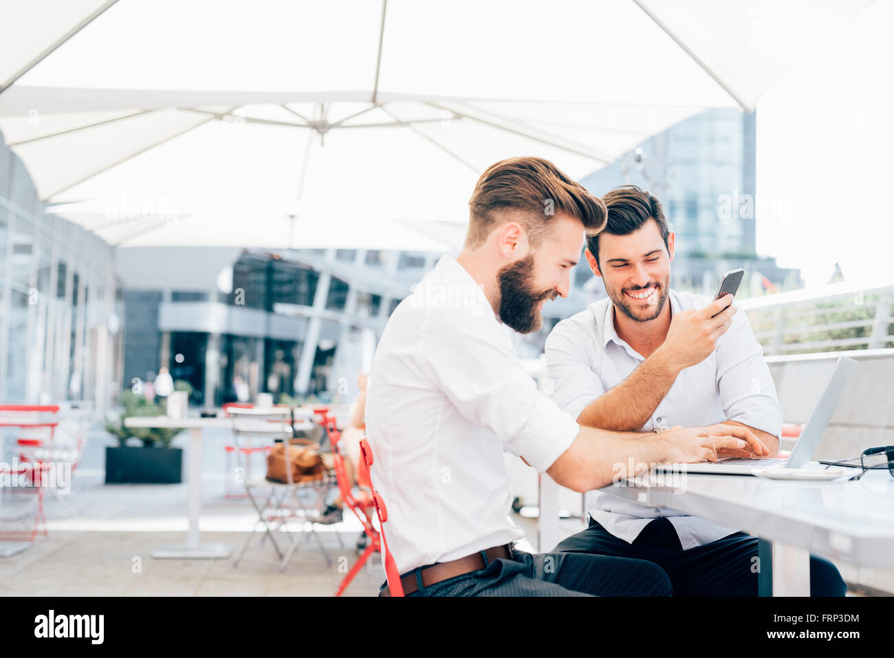 Two businessmen sitting in a bar hi-res stock photography and images ...
