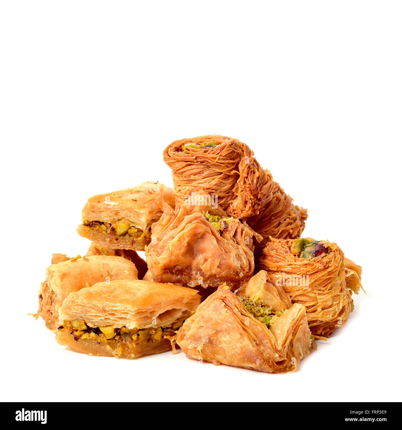 closeup of some different baklava pastries on a white background Stock ...