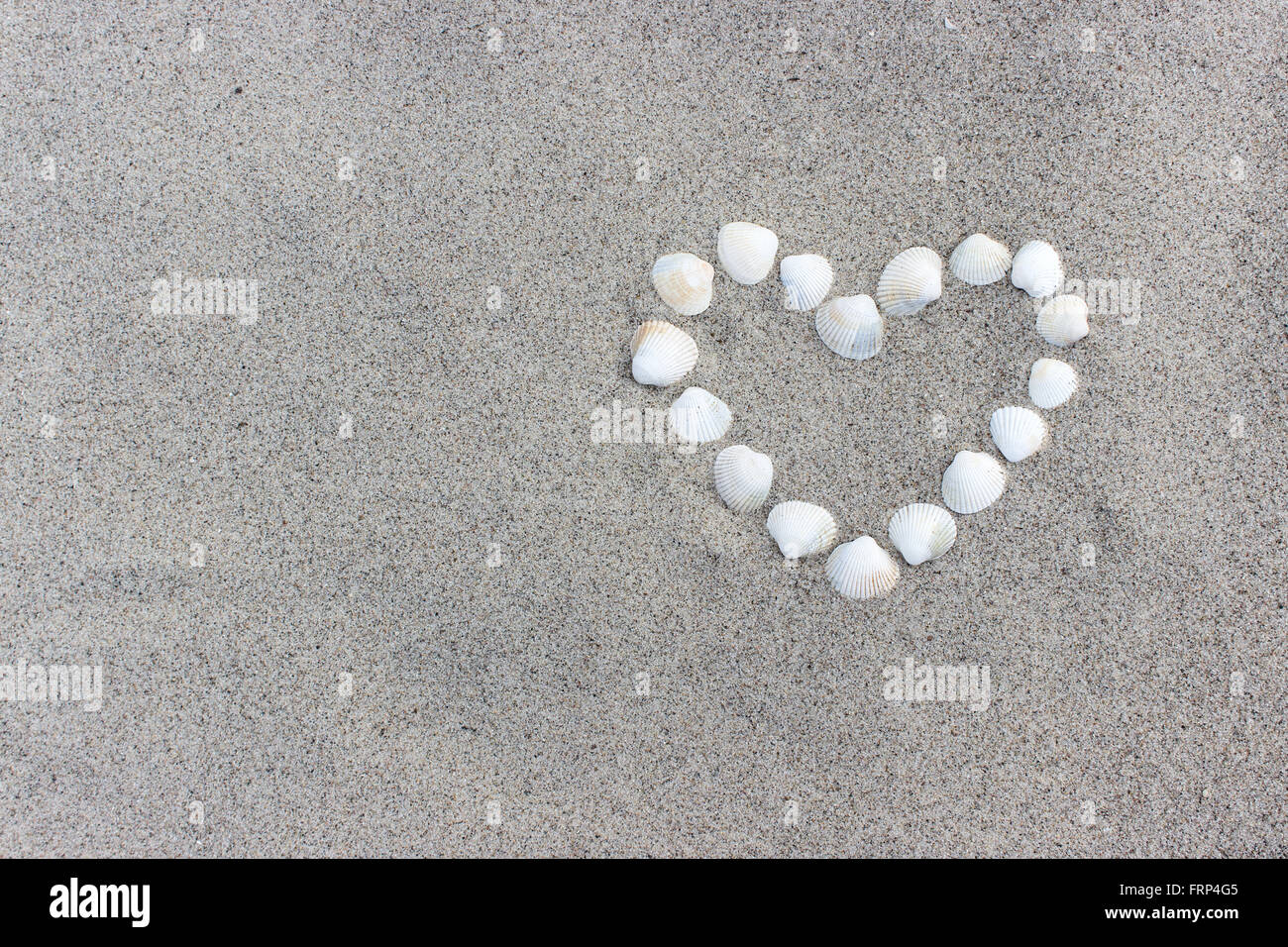 Heart made shells on beach hi-res stock photography and images - Alamy
