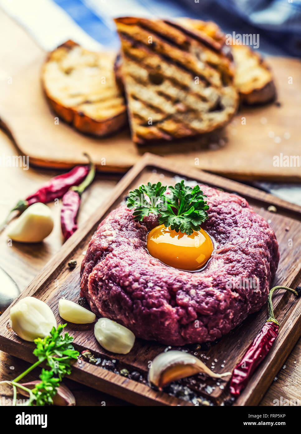 Raw Beef Tasty Steak Tartare Classic Steak Tartare On Wooden Board raw-beef-tasty-steak-tartare-classic-steak-tartare-on-wooden-board