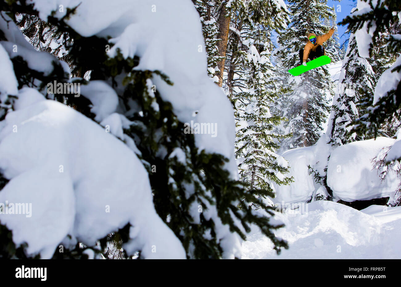 Catching air on a snowboard Stock Photo - Alamy
